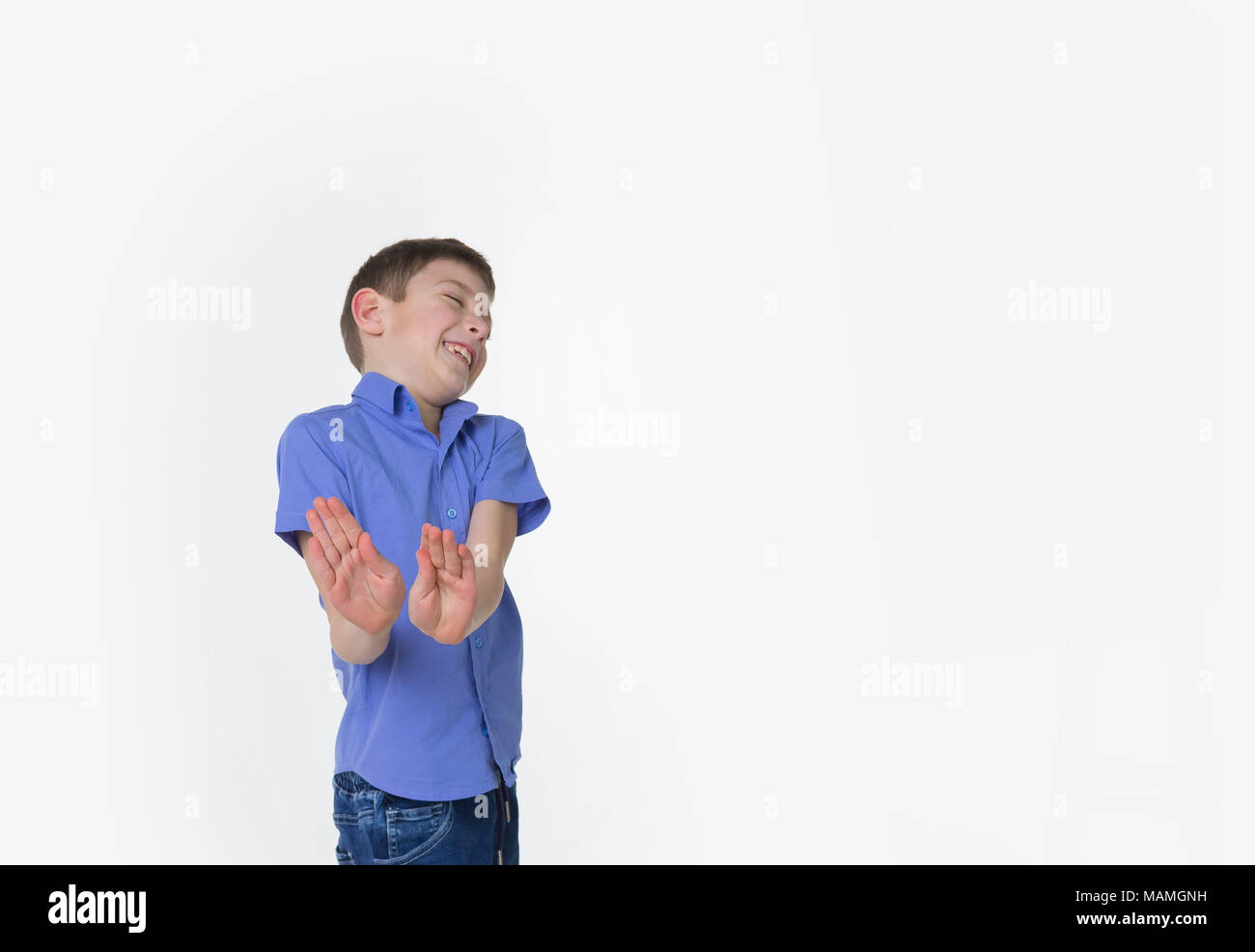 Portrait of a young boy making stop gesture on white background Stock ...