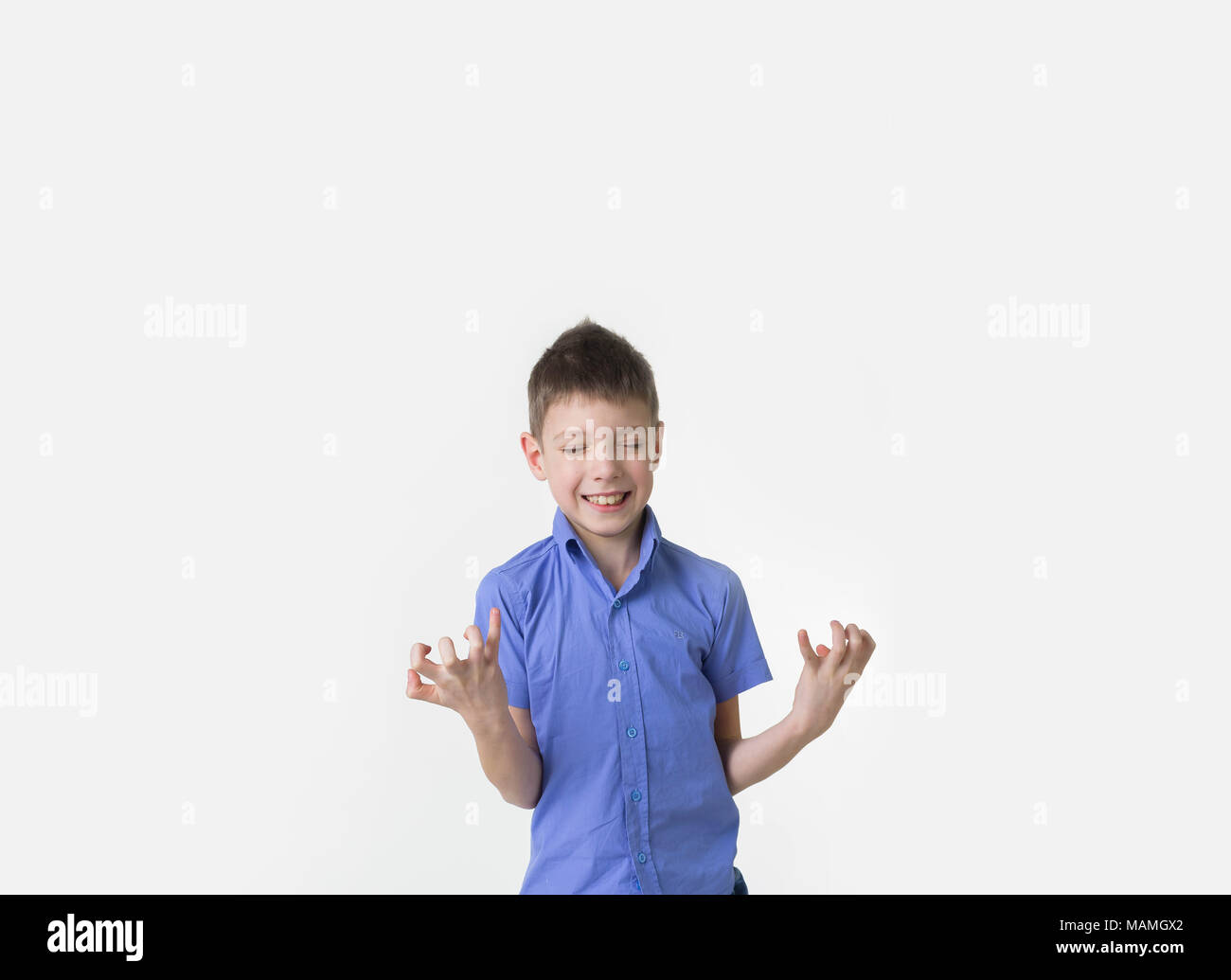 portrait of a handsome young teen boy winning over white background ...