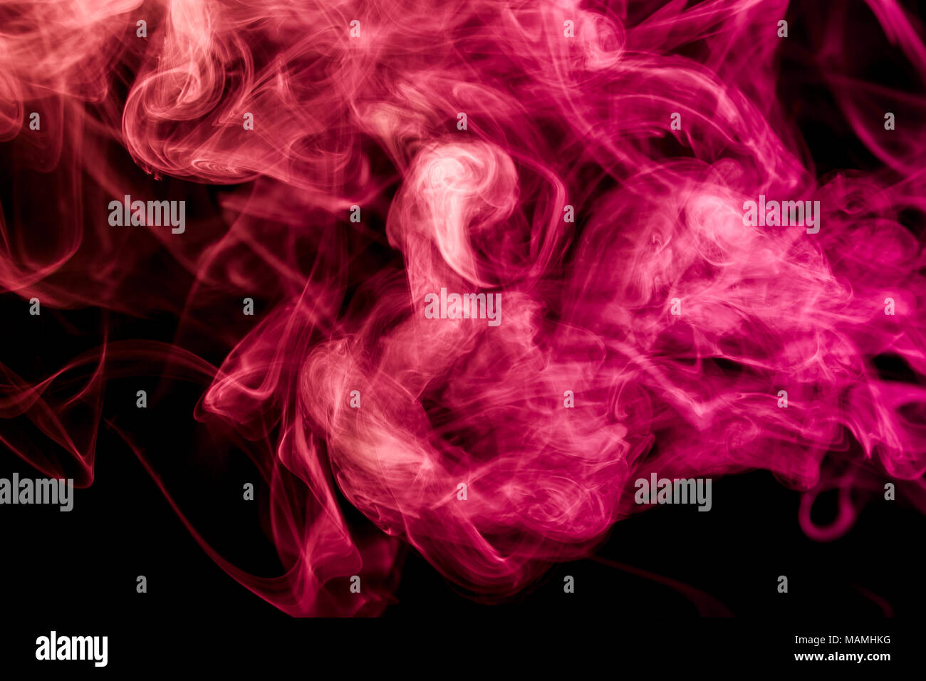 Red and pink cloud of smoke of black isolated background. Background ...