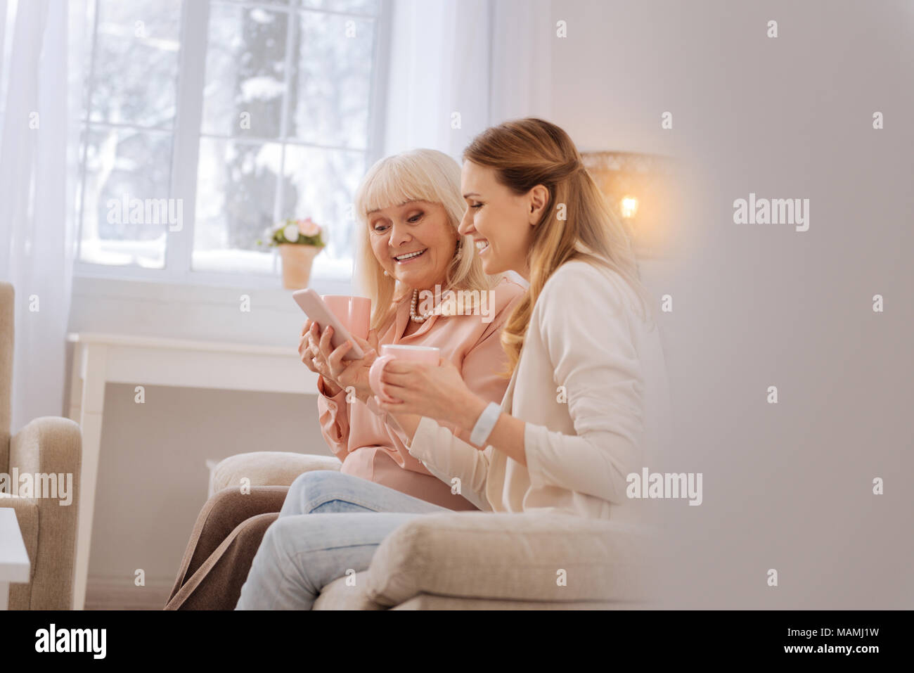 Joyful delighted women enjoying their time together Stock Photo - Alamy
