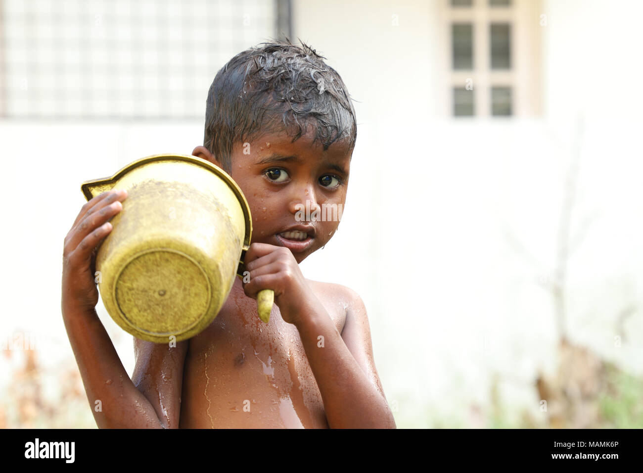 village kid bathing Stock Photo - Alamy