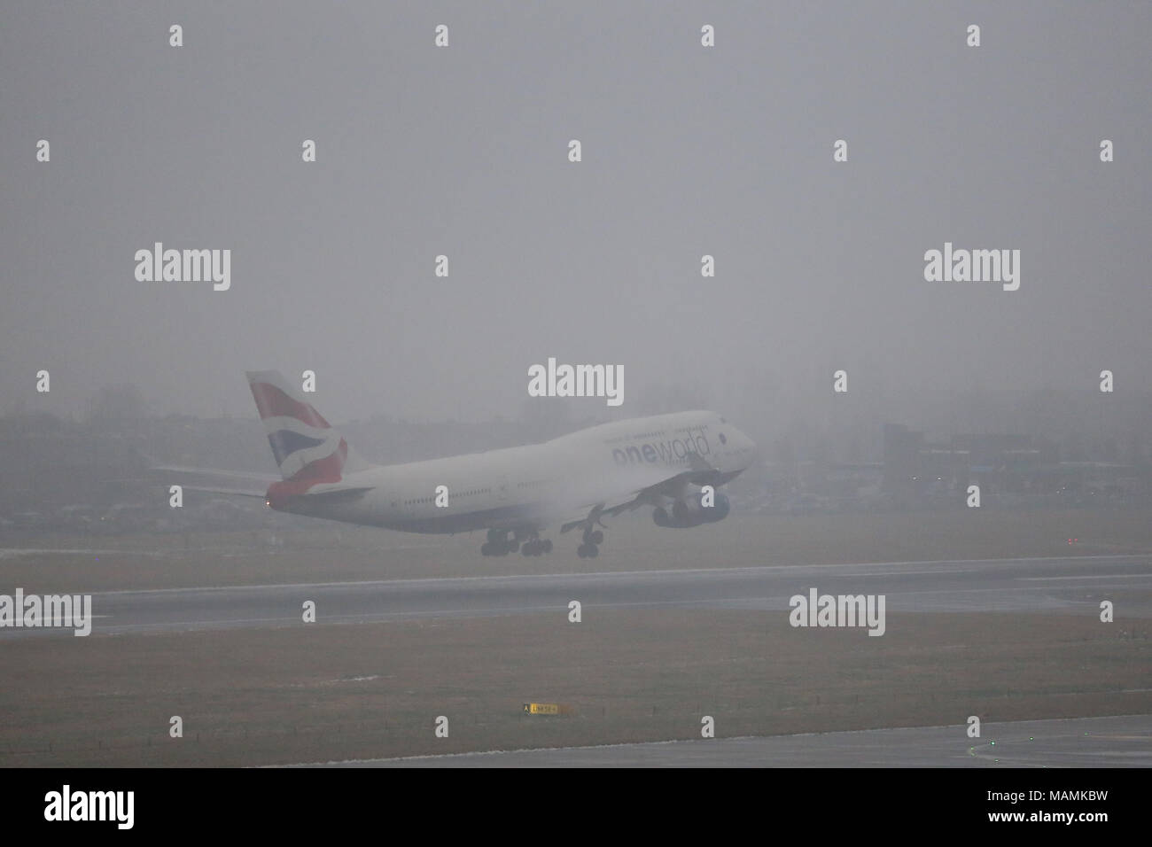 Aeroplanes lands in dense fog at London Heathrow Terminal 5 Featuring ...
