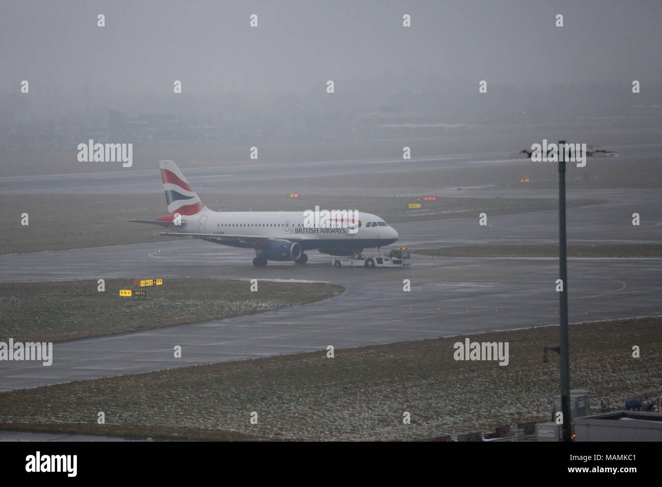 Aeroplanes lands in dense fog at London Heathrow Terminal 5 Featuring ...