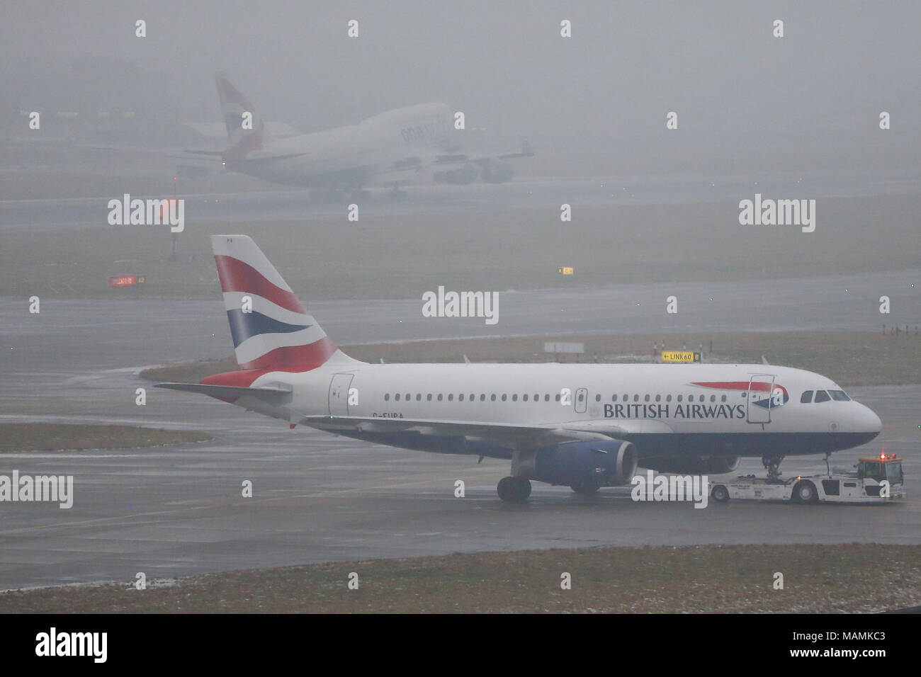 Aeroplanes lands in dense fog at London Heathrow Terminal 5 Featuring ...