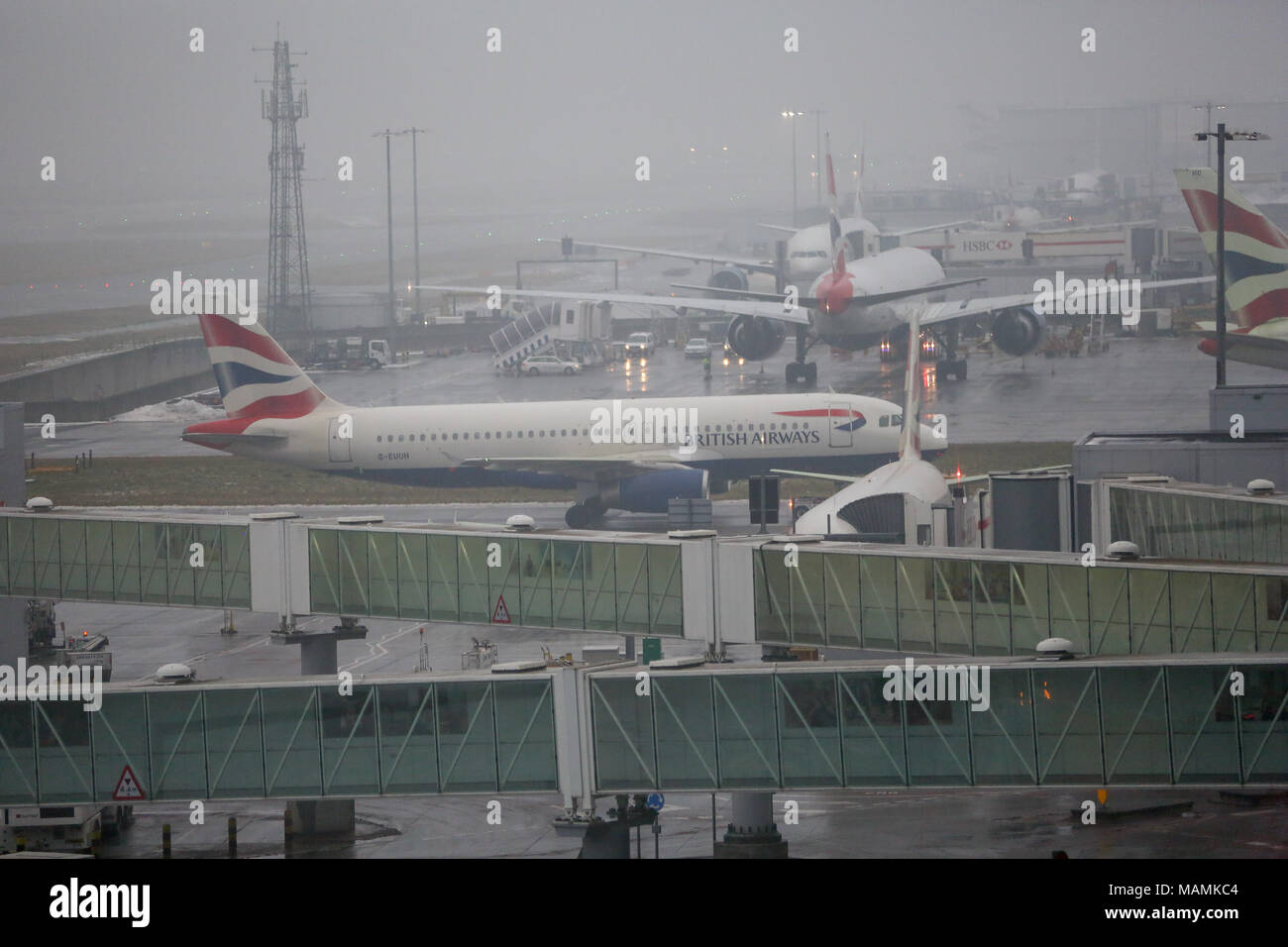 Aeroplanes lands in dense fog at London Heathrow Terminal 5 Featuring ...