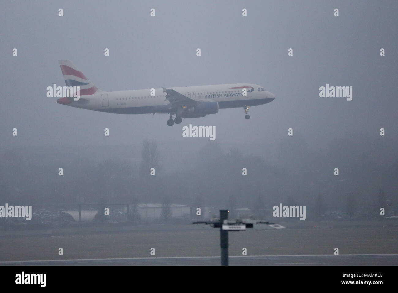 Aeroplanes lands in dense fog at London Heathrow Terminal 5 Featuring ...