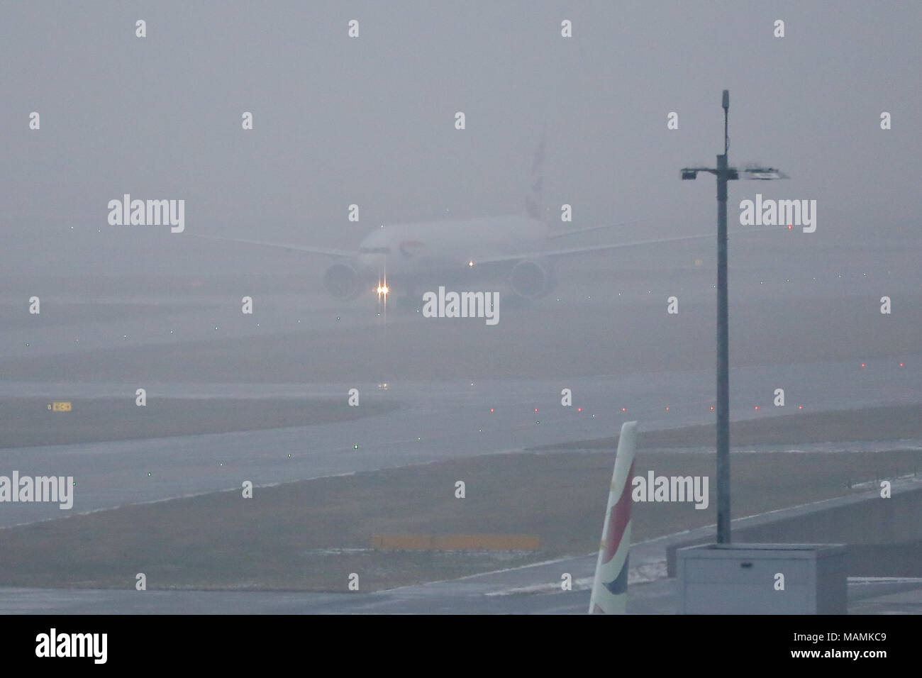Aeroplanes lands in dense fog at London Heathrow Terminal 5 Featuring ...