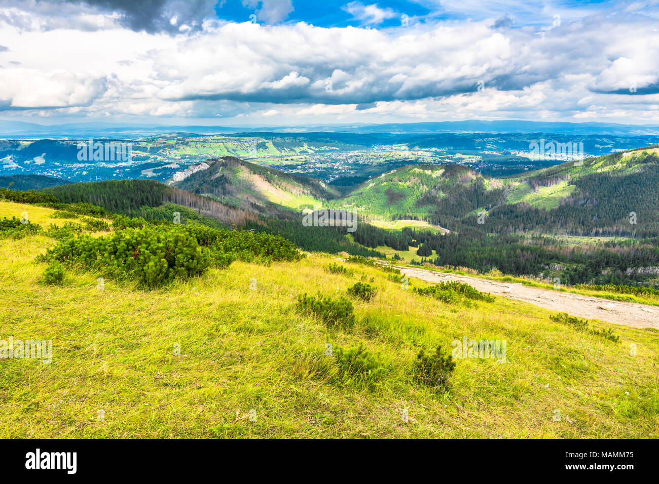 Panoramic view of mountains, spring landscape with hiking trail and ...