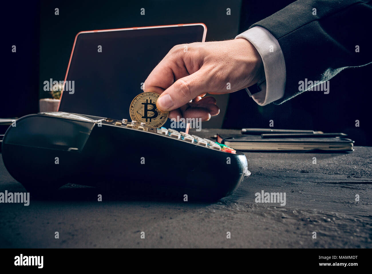 Bitcoin, credit card and POS-terminal Stock Photo - Alamy