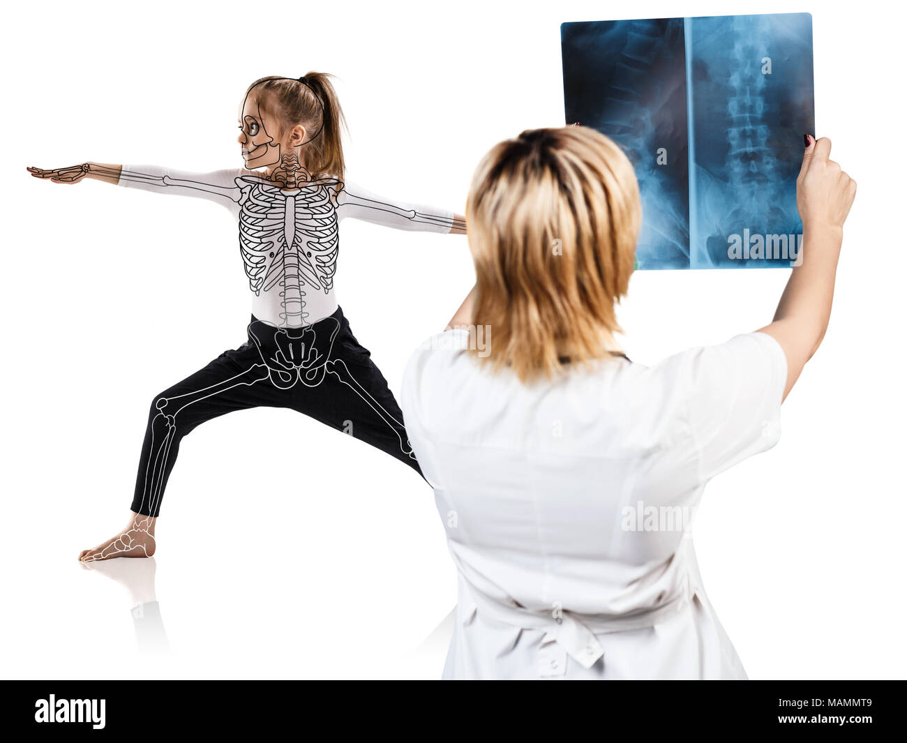 Female doctor looks on x-ray of little girl in yoga pose Stock Photo ...