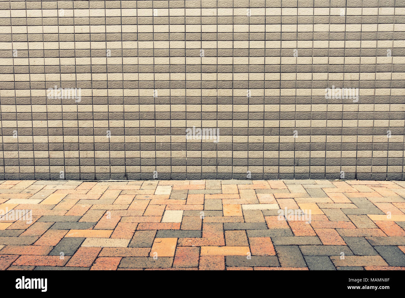 Ceramic block wall and footpath walkway Stock Photo - Alamy