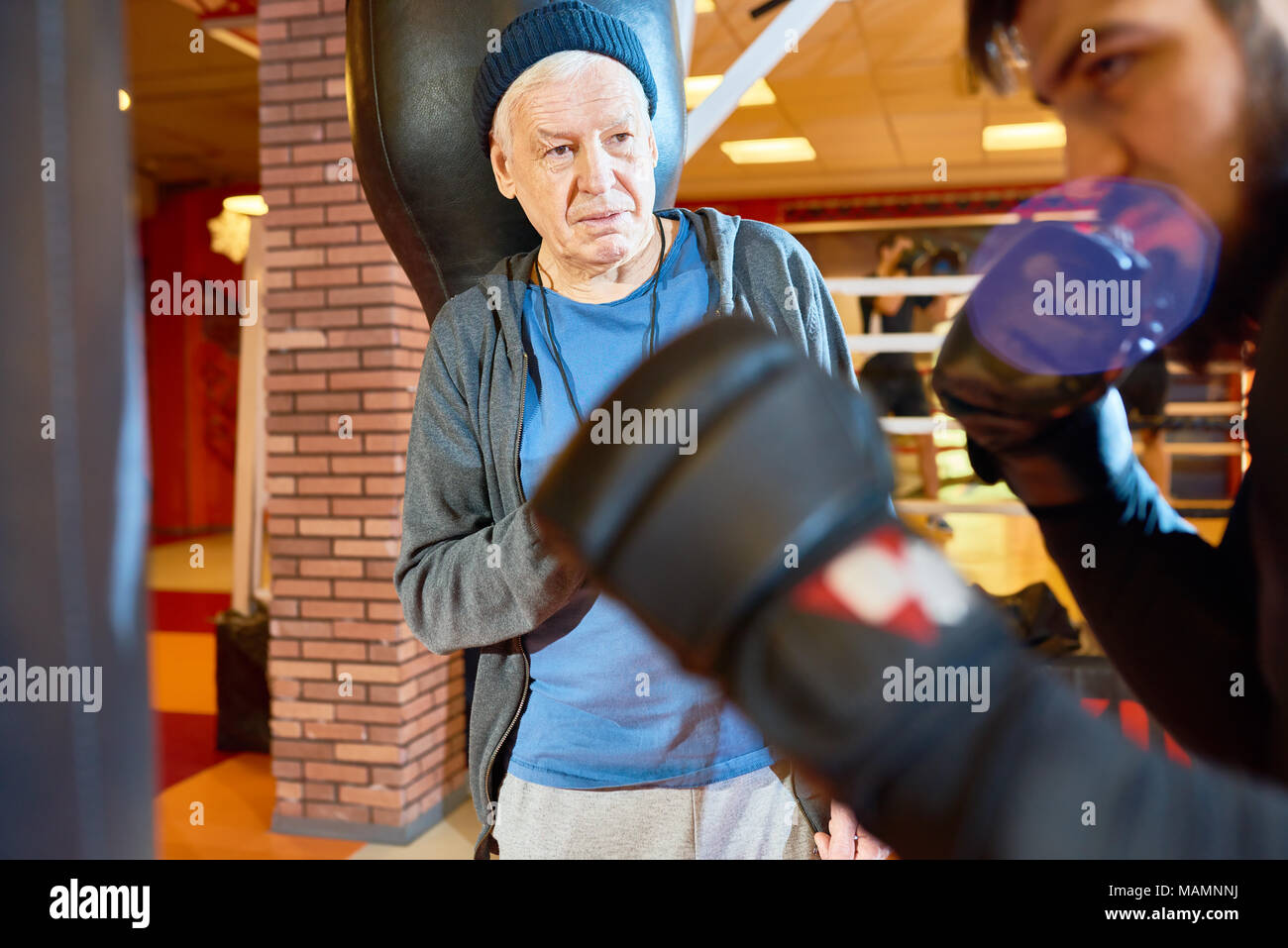 Senior Boxing Coach Stock Photo - Alamy