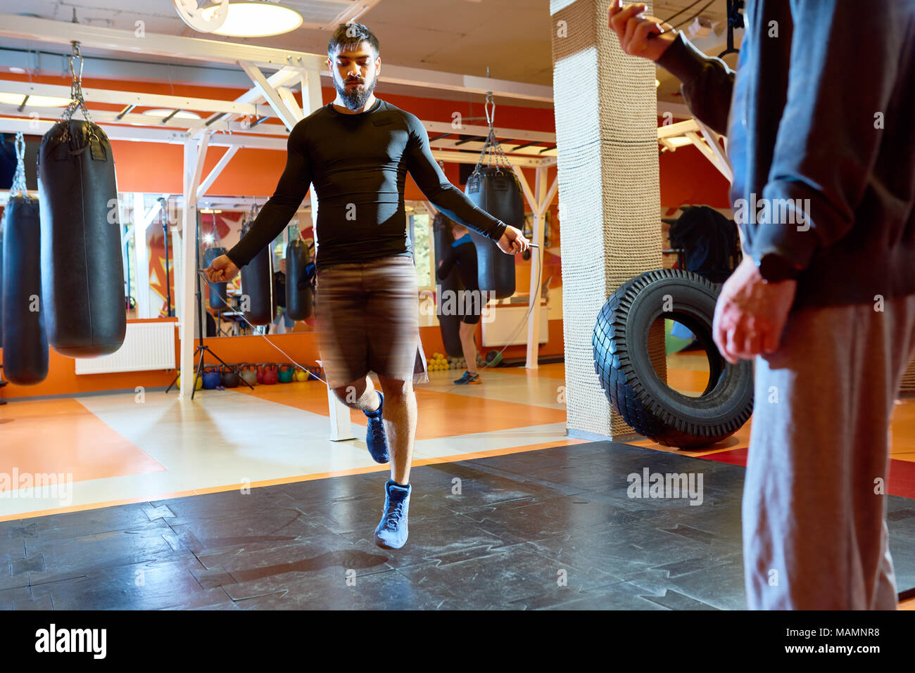 Strong Man Jumping Rope Stock Photo - Alamy