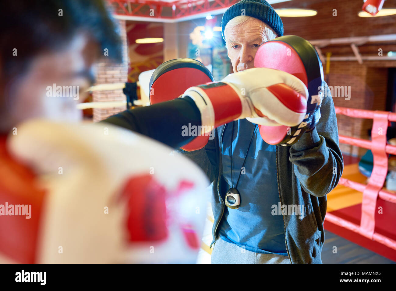 Boxer training coach in ring hi-res stock photography and images - Alamy