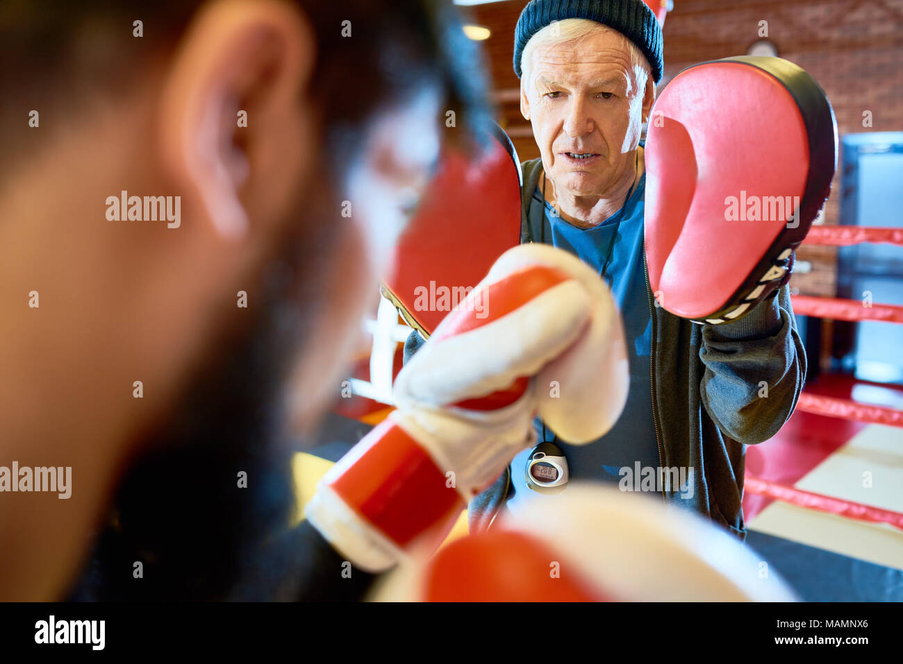 Senior Coach Training Boxer Stock Photo - Alamy