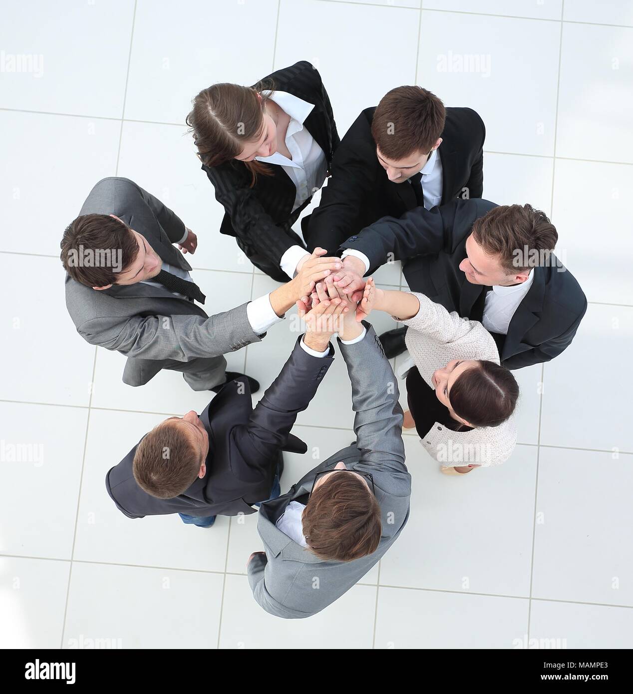 view from the top.Business people holding hands Stock Photo - Alamy
