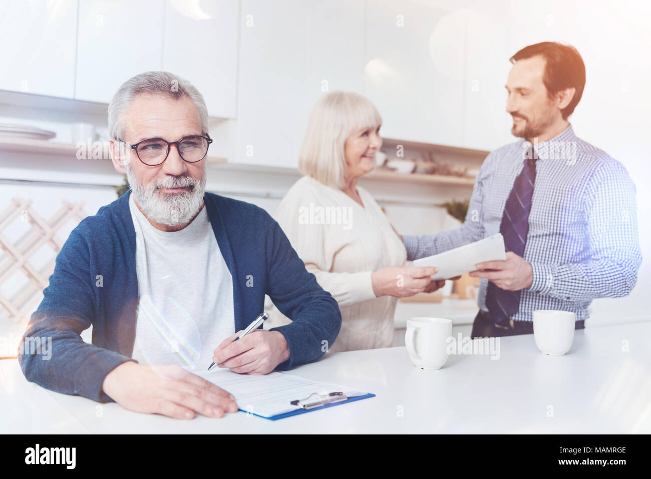Couple Signing Papers High Resolution Stock Photography and Images - Alamy