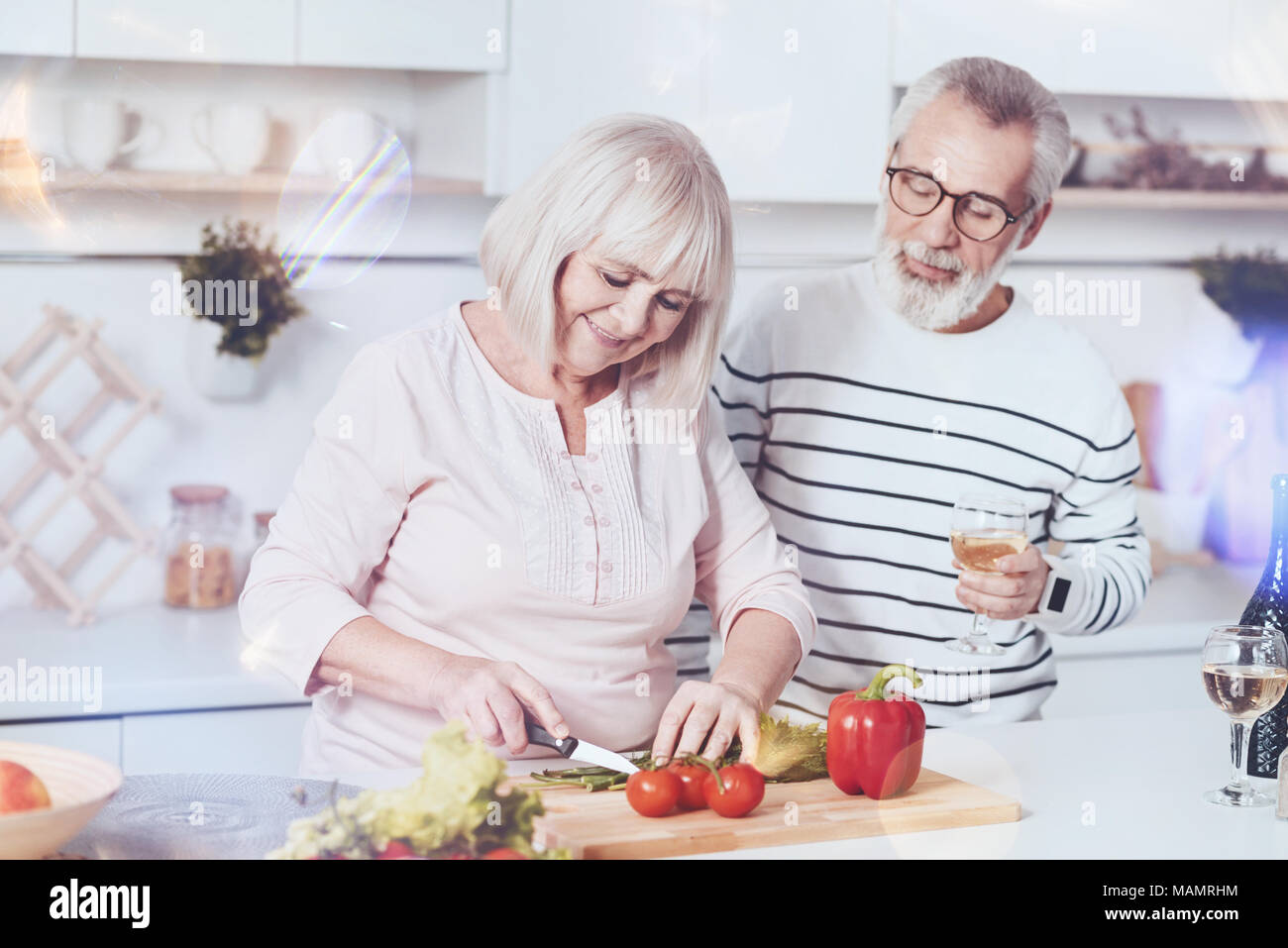 Pleasant loving aged couple making vegetable salad Stock Photo - Alamy