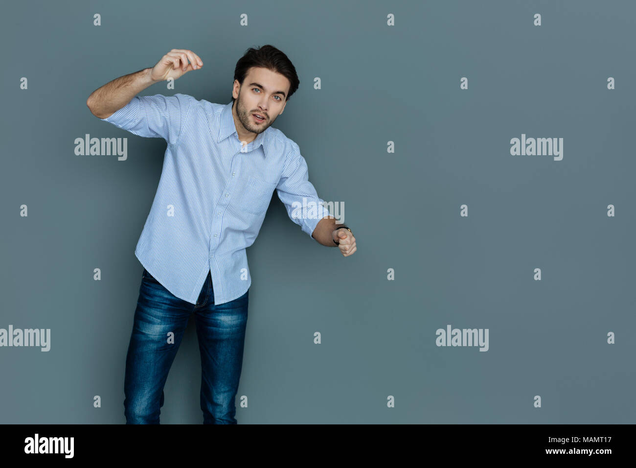 Pleasant nice man moving his hands Stock Photo - Alamy