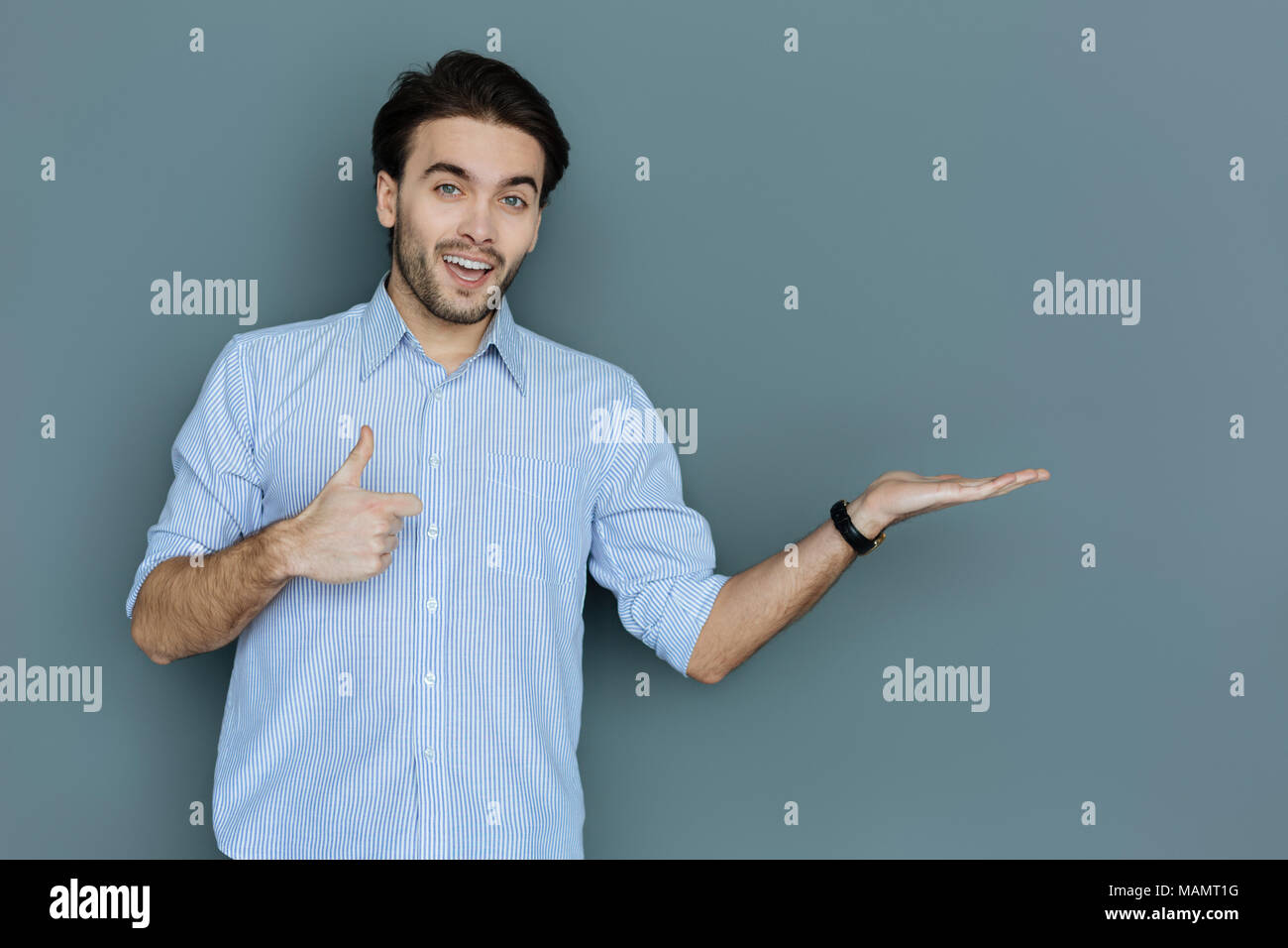 Positive nice man showing OK gesture Stock Photo - Alamy