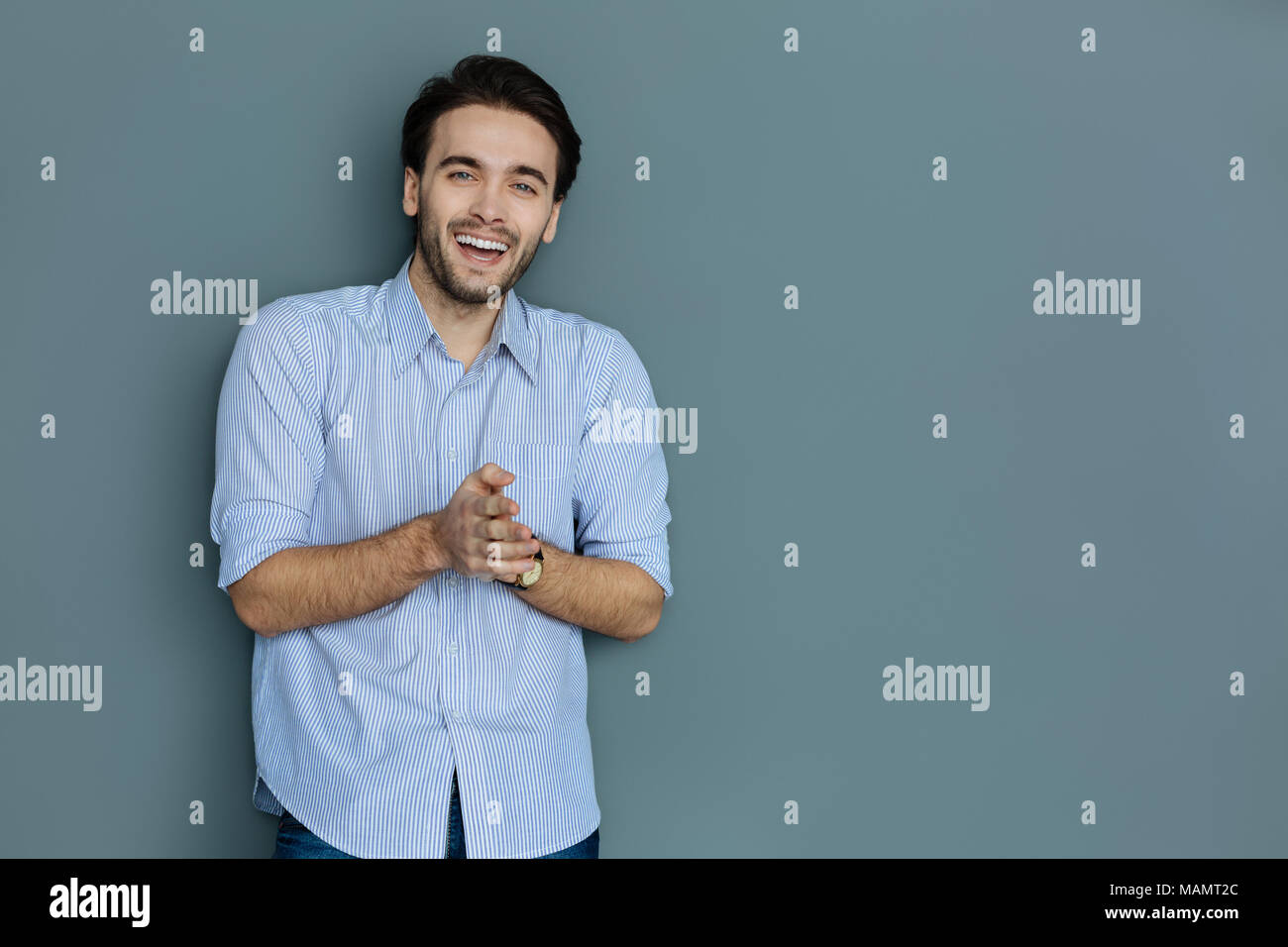 Joyful positive man feeling happy Stock Photo - Alamy Joyful positive man feeling happy Stock Photo - Alamy