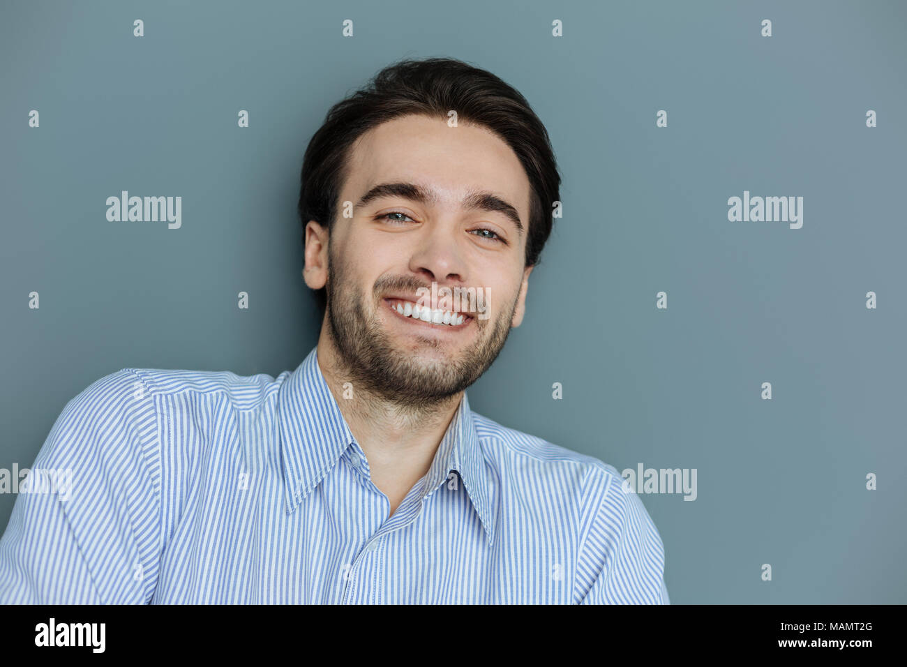 Portrait of a nice handsome man smiling Stock Photo - Alamy