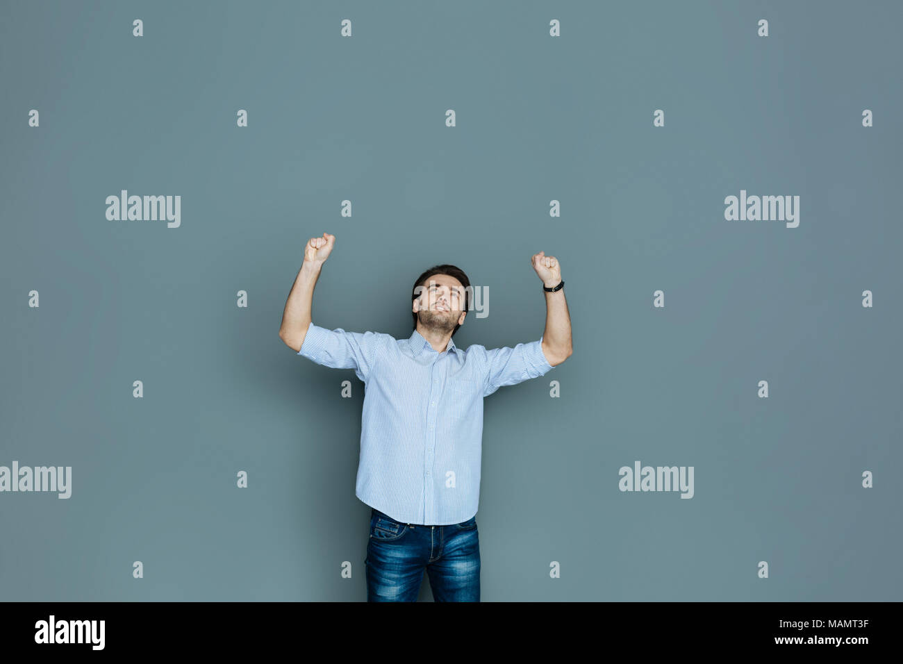 Pleasant young man expressing emotions hi-res stock photography and ...