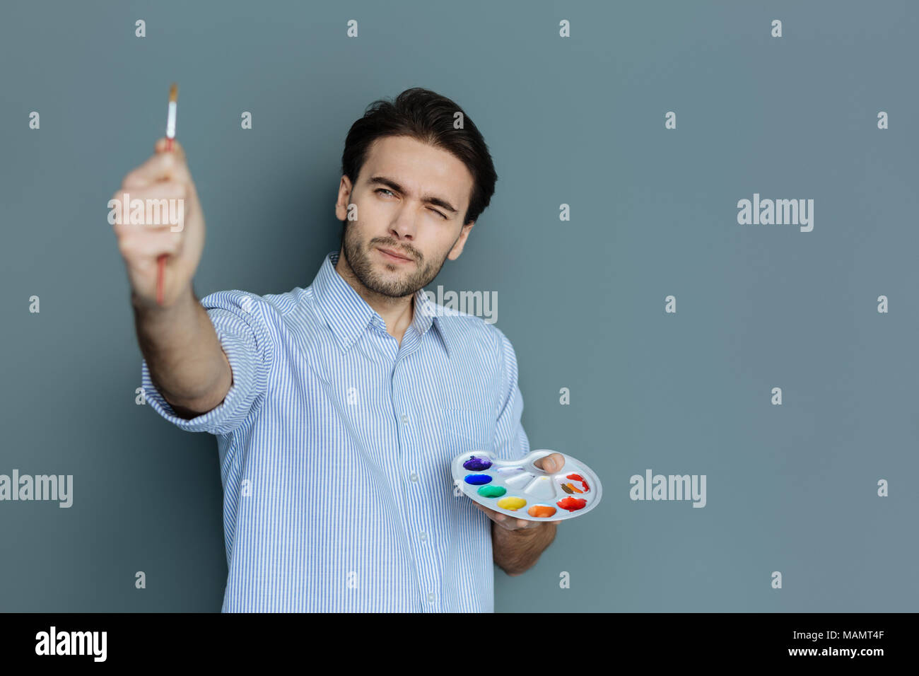 Handsome artist holding palette hi-res stock photography and images - Alamy