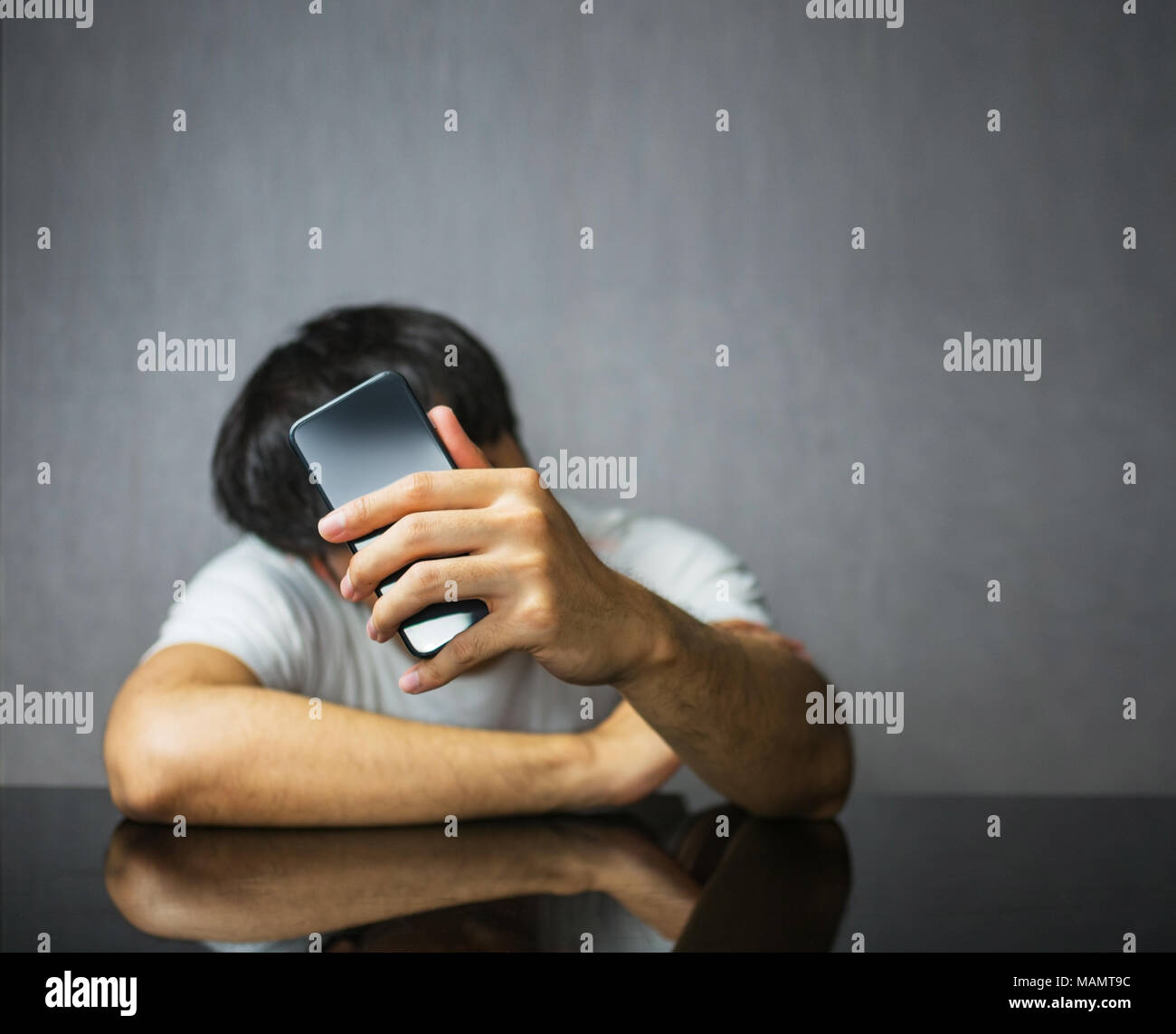 Wait and check phone screen Stock Photo - Alamy