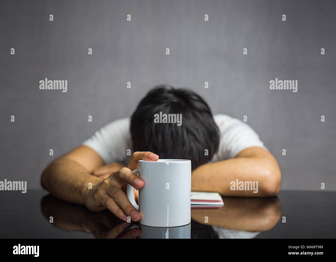 Stressed young man laptop messy desk hi-res stock photography and ...