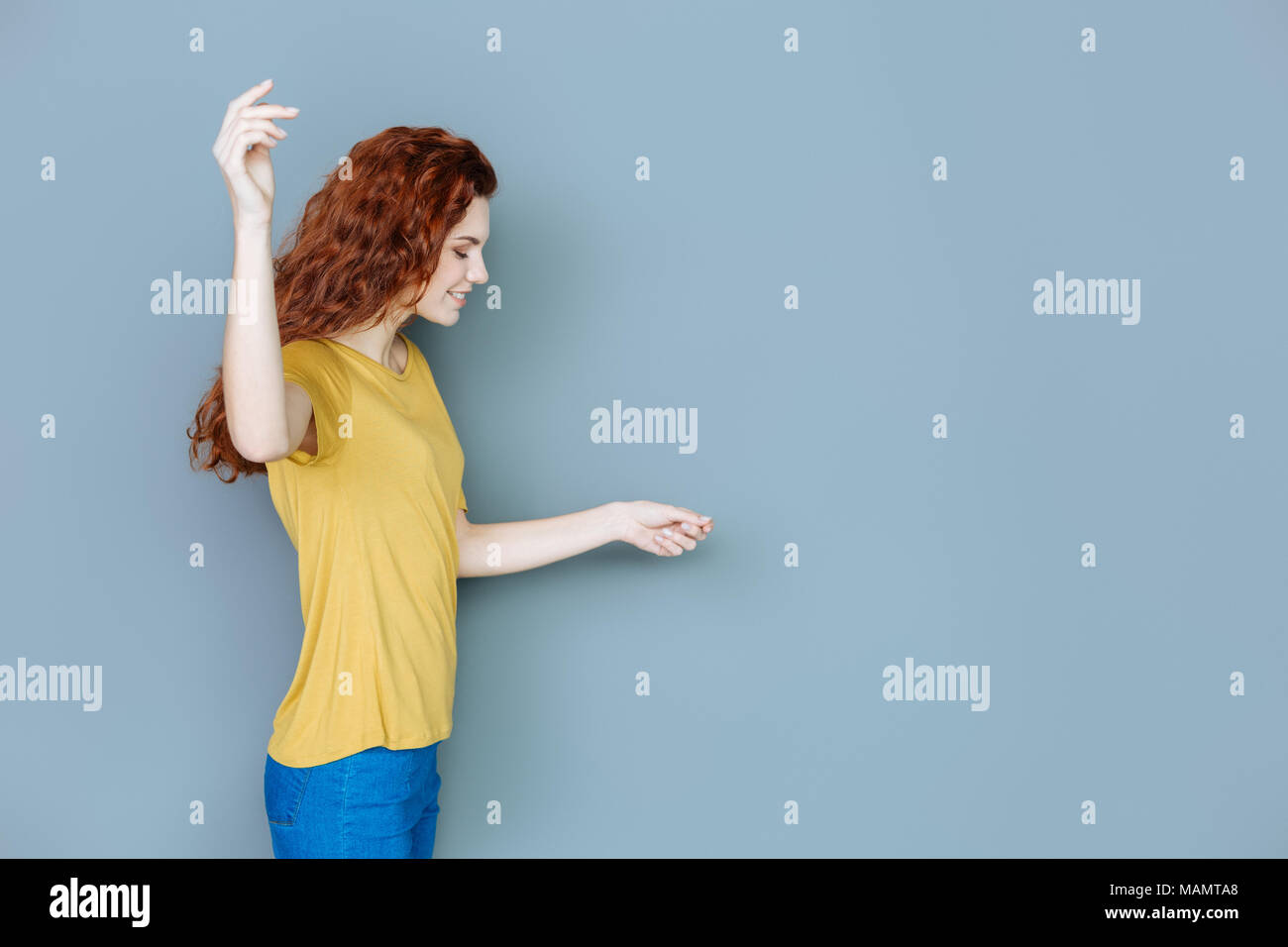 Nice delighted woman looking at some object Stock Photo - Alamy