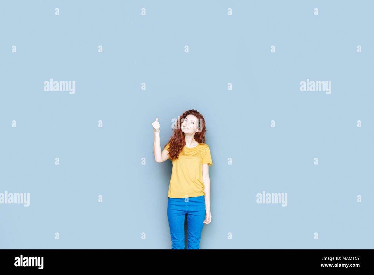 Nice happy woman looking up Stock Photo - Alamy