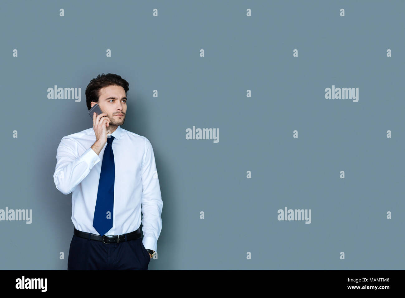 Smart confident man making a call Stock Photo - Alamy