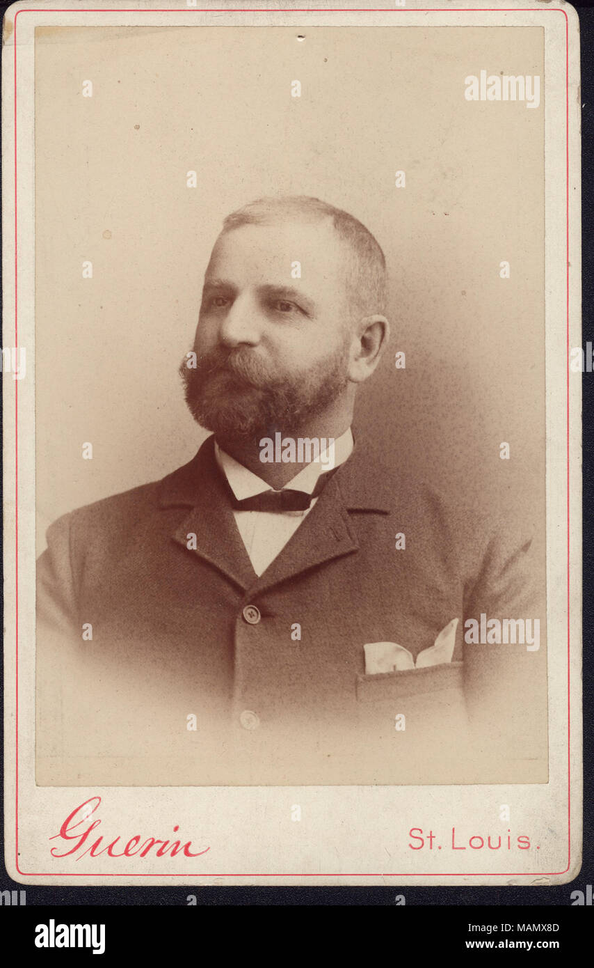 Formal bust portrait of F. Miller wearing a suit, with his head turned ...