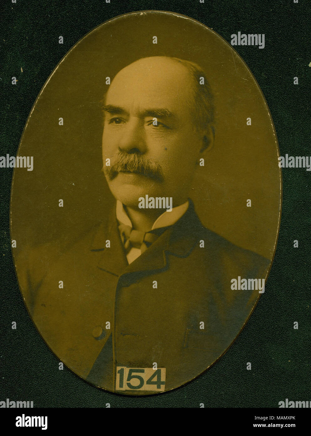 Formal bust portrait of George W. J. Knight wearing a suit and bow tie ...