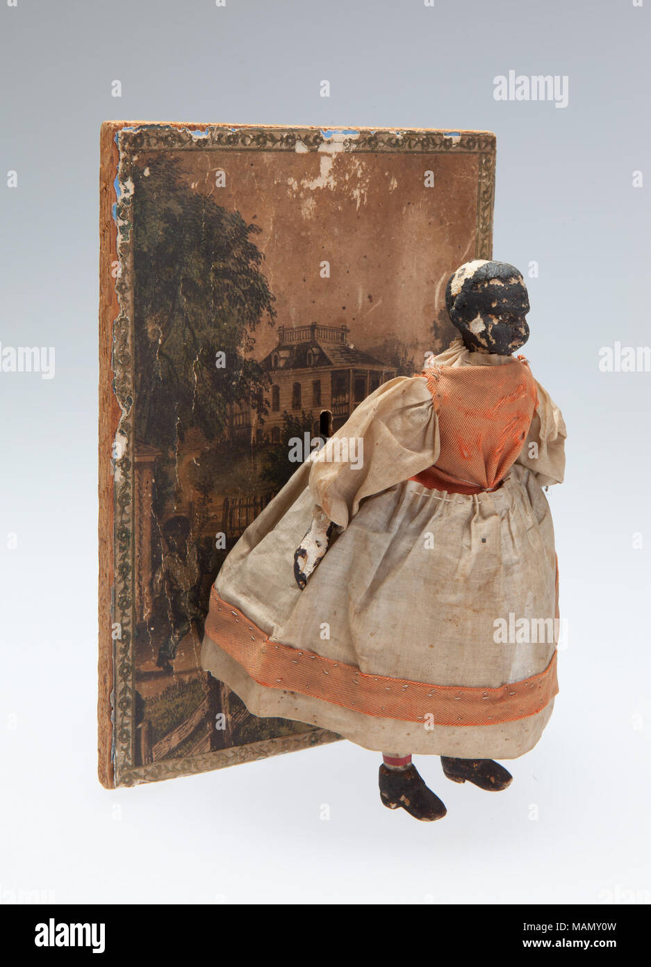 Mechanical wind-up dancing figure of an African American female. Figure ...