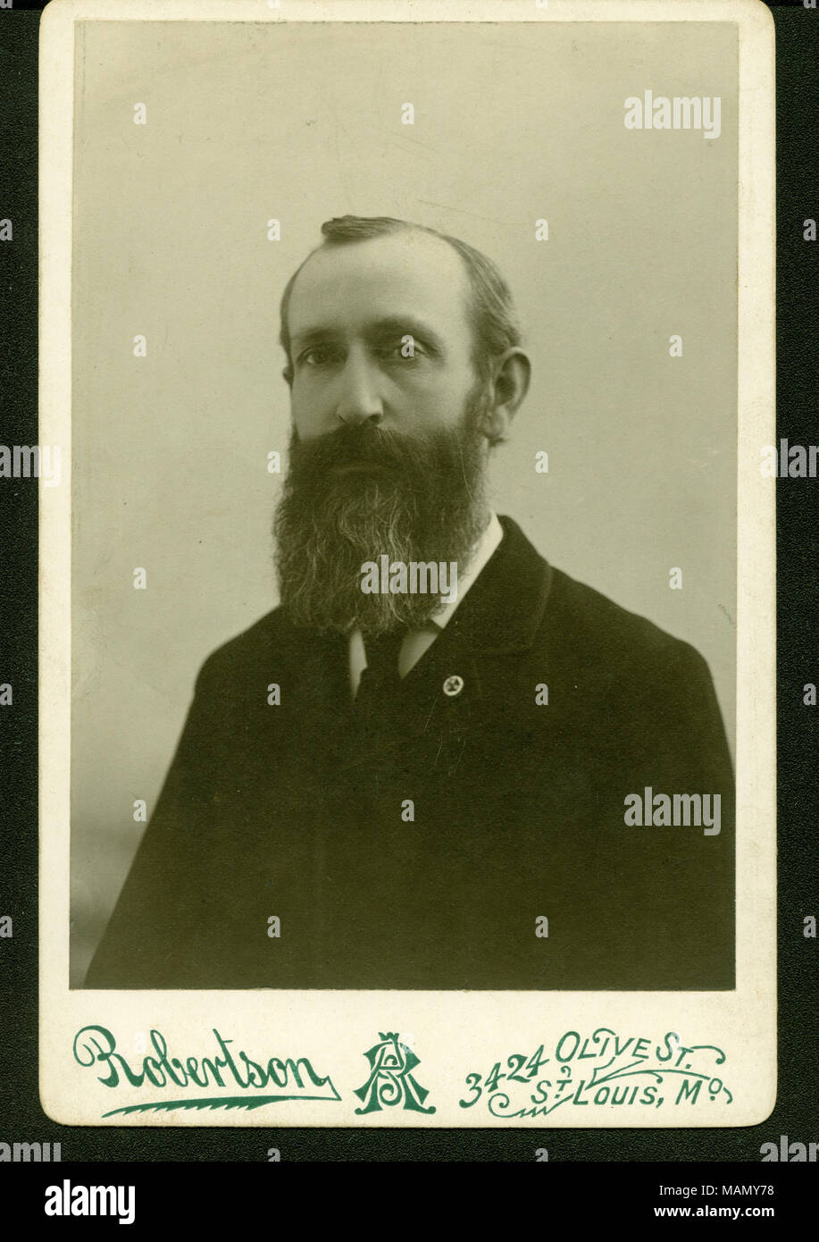 Formal bust portrait of Joseph E. Corwin wearing a suit and tie, and ...