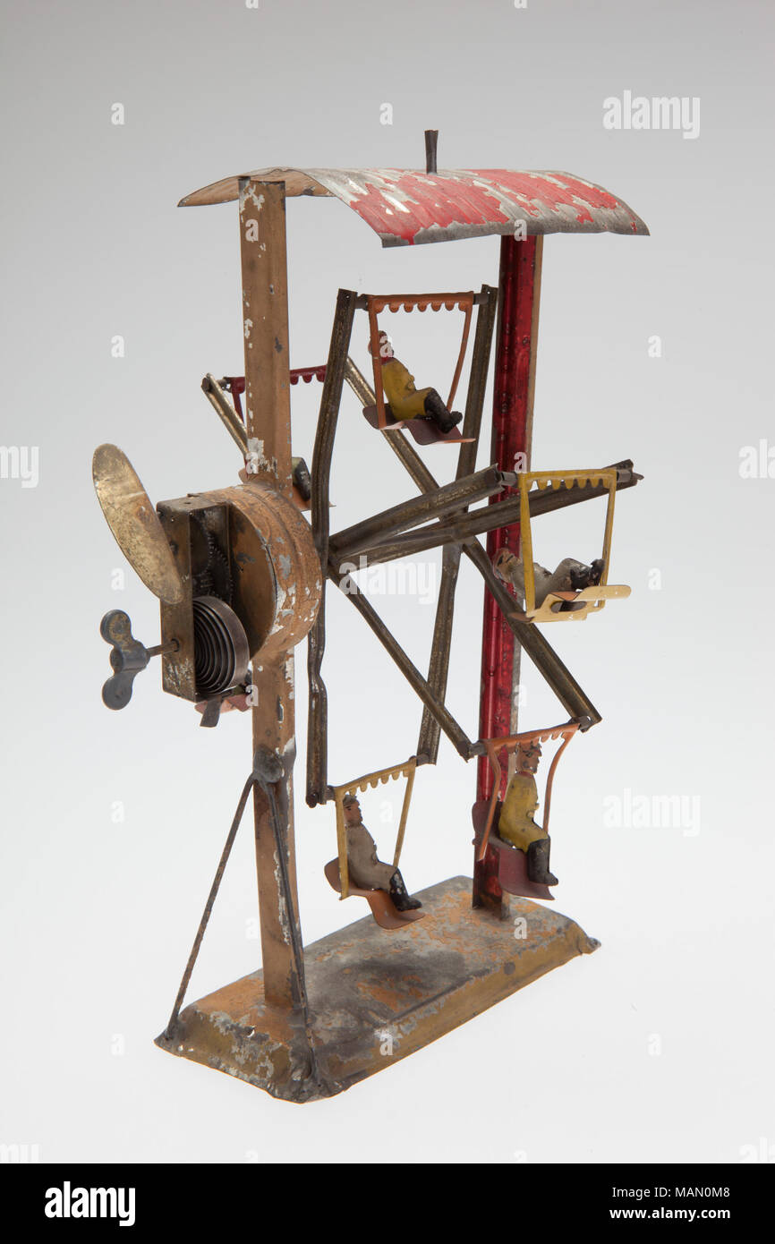 Clockwork mechanical tin toy Ferris wheel. Title: Clockwork Tin Toy ...