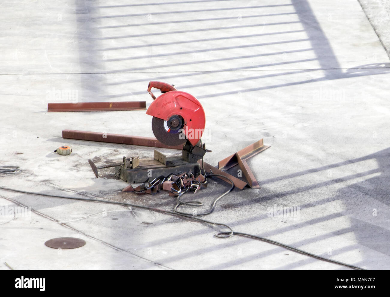 Cutting of steel material. Grinder ready for work on concrete floor ...