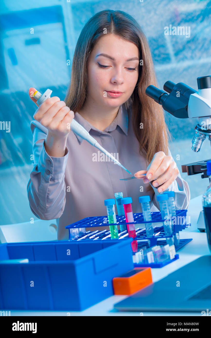 female technician take sample on microscope slide Stock Photo - Alamy