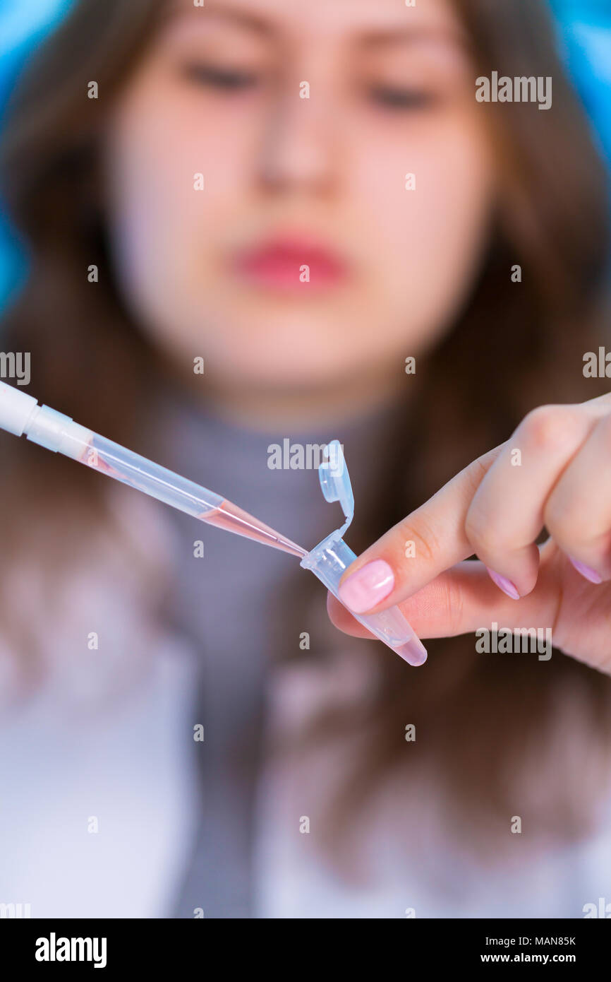 laboratory female assistant with pipette Stock Photo - Alamy