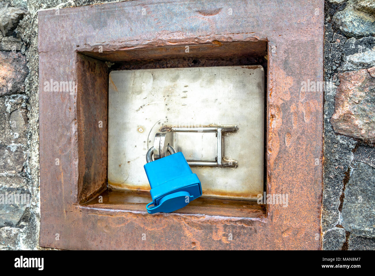 Outdoor safe with lock build in a stone wall Stock Photo - Alamy