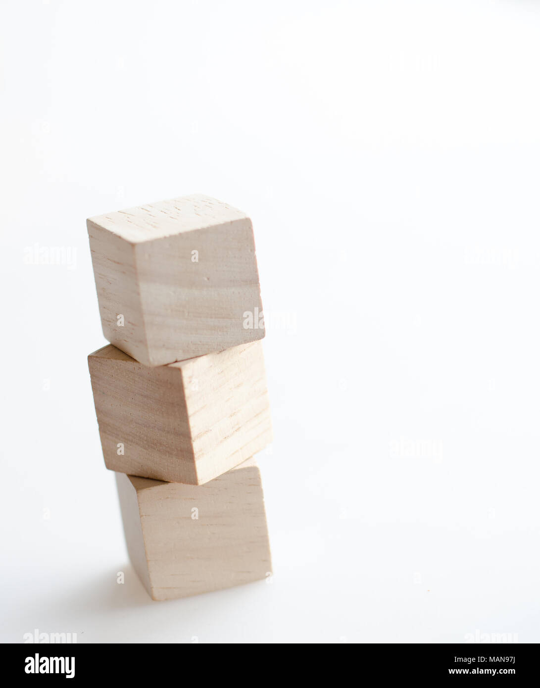 brown wood bricks tower on white background Stock Photo - Alamy