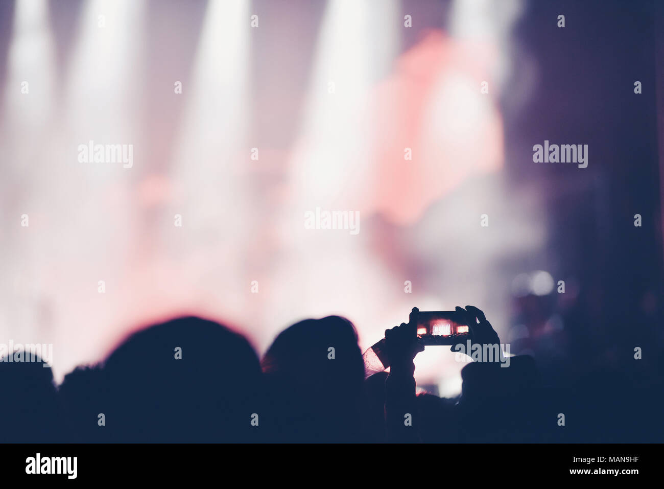 Crowd with cell phones hi-res stock photography and images - Alamy
