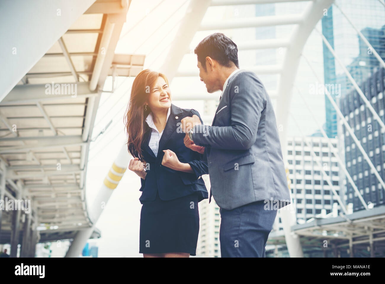 Business couple hands up doing yes outdoor. Concept of teamwork Stock ...