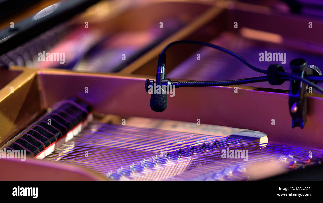A grand piano on a performance stage Stock Photo - Alamy