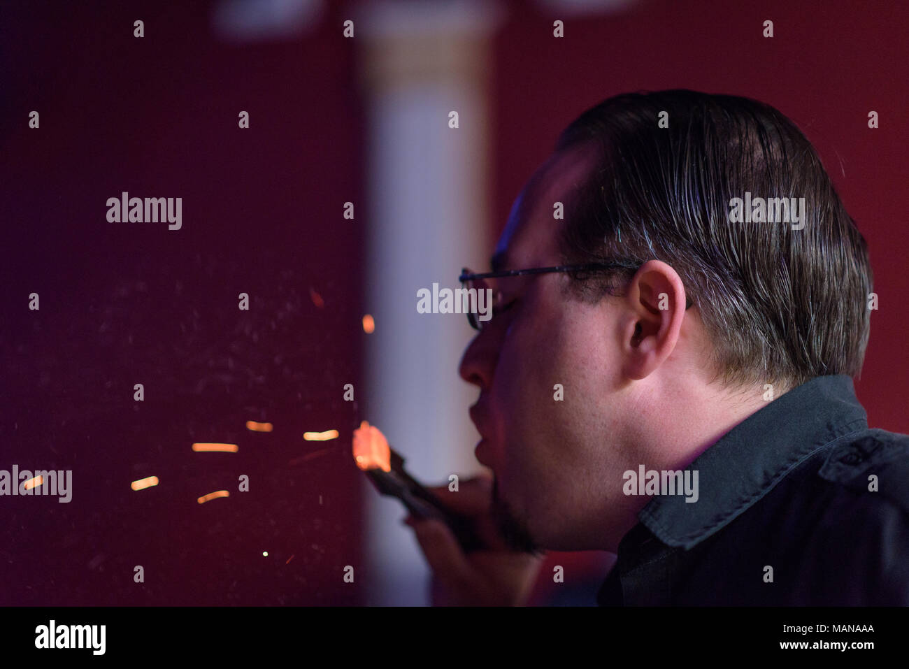 Exhaling smoke hi-res stock photography and images - Alamy