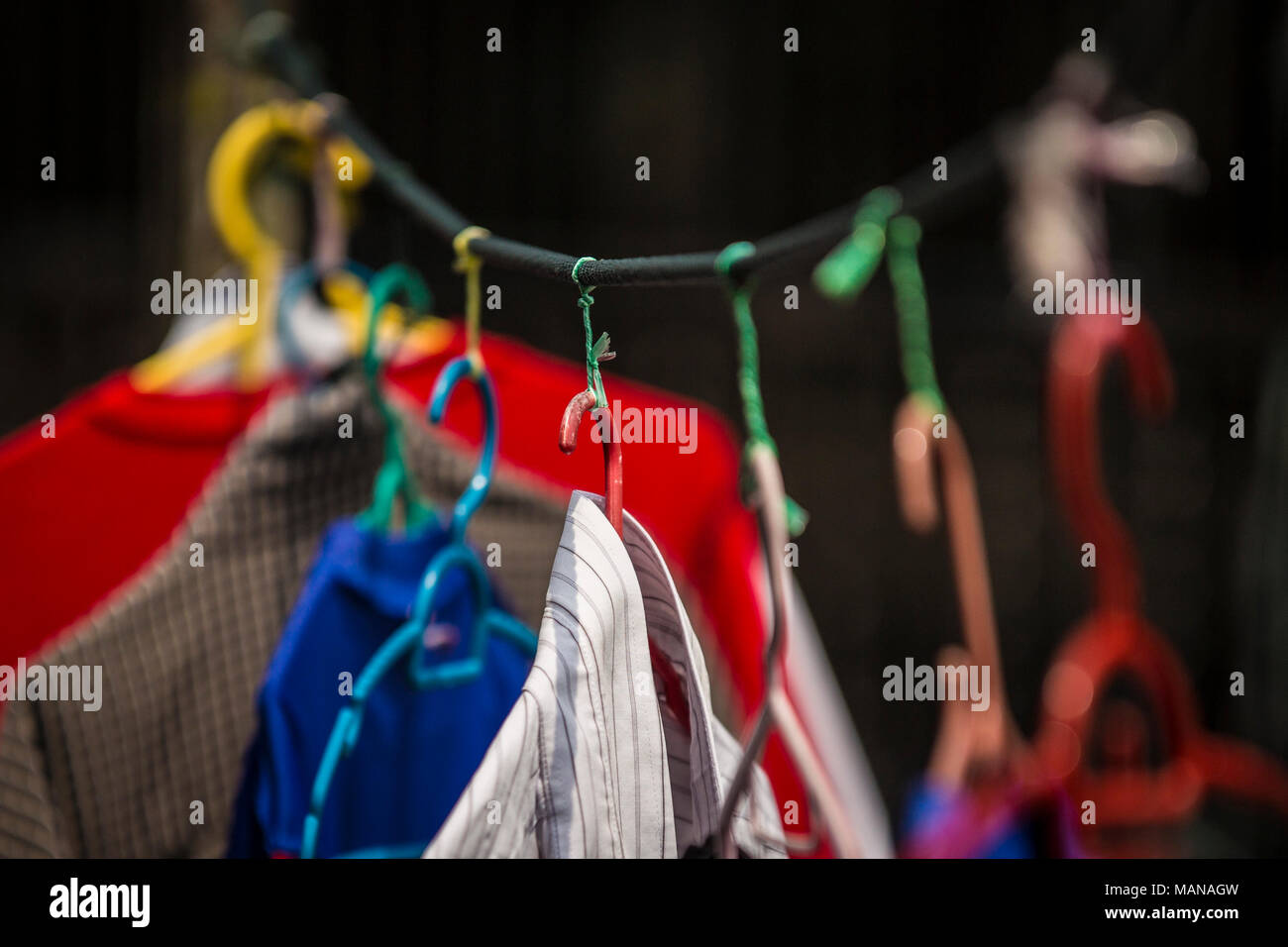 Laundry hanging outside of house to let dry under hot humid sun Stock ...