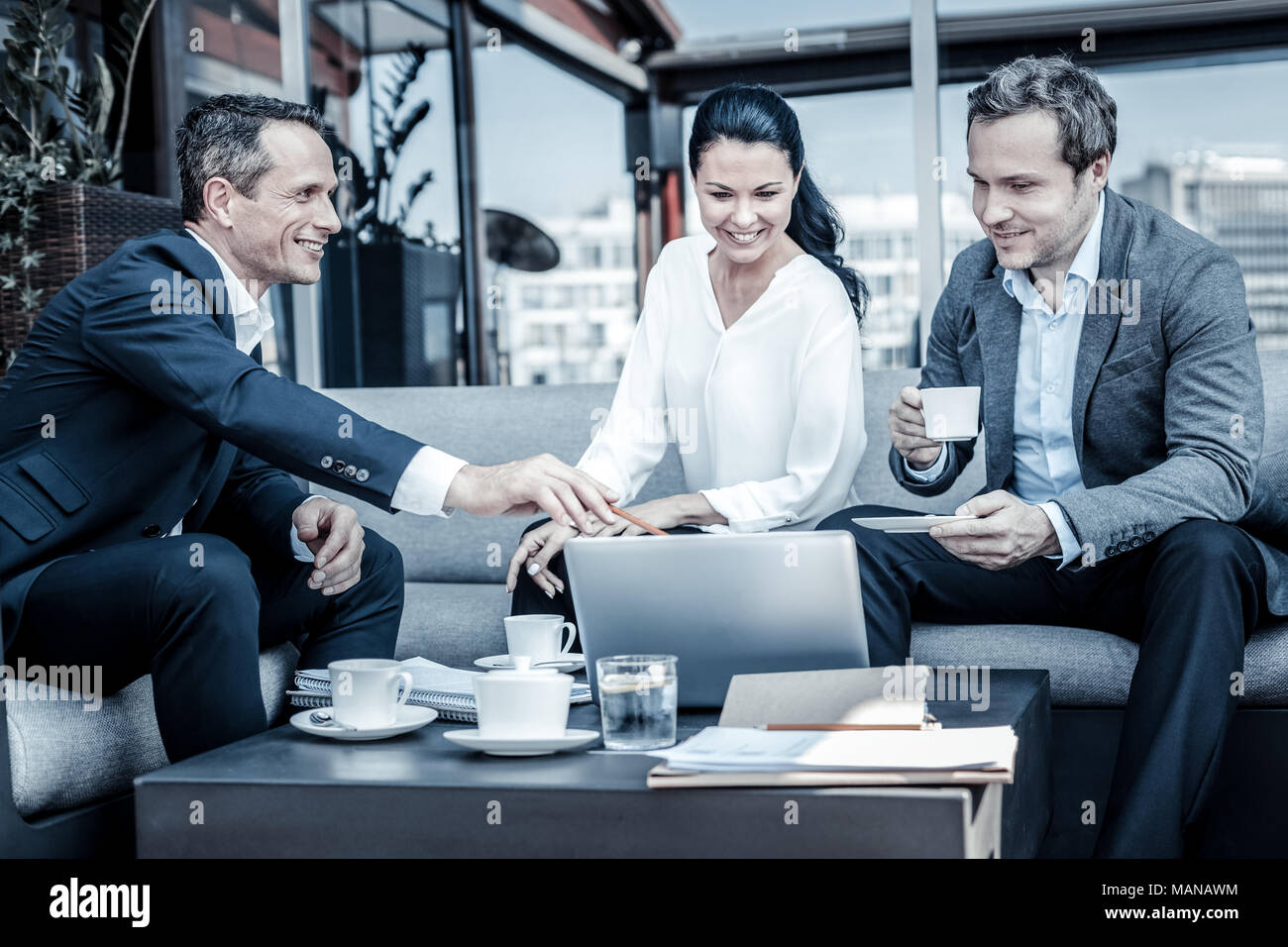 Nice happy businessman presenting his ideas Stock Photo - Alamy Nice happy businessman presenting his ideas Stock Photo - Alamy