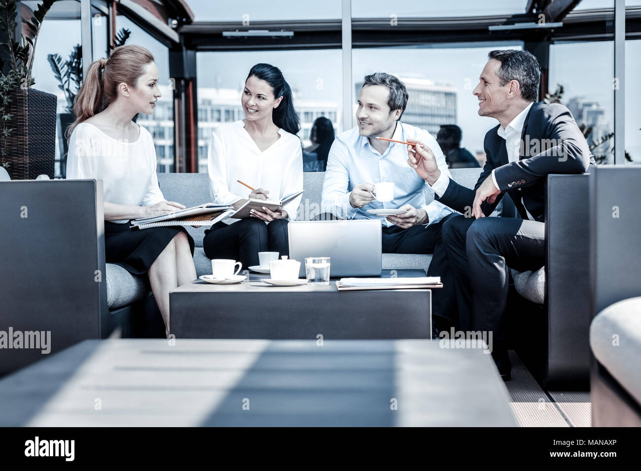 Smart nice team working together Stock Photo - Alamy